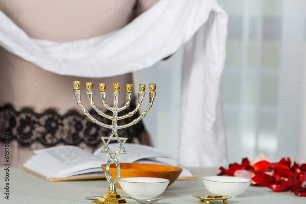 Before the wedding, a Jewish woman holds a white handkerchief in her ...