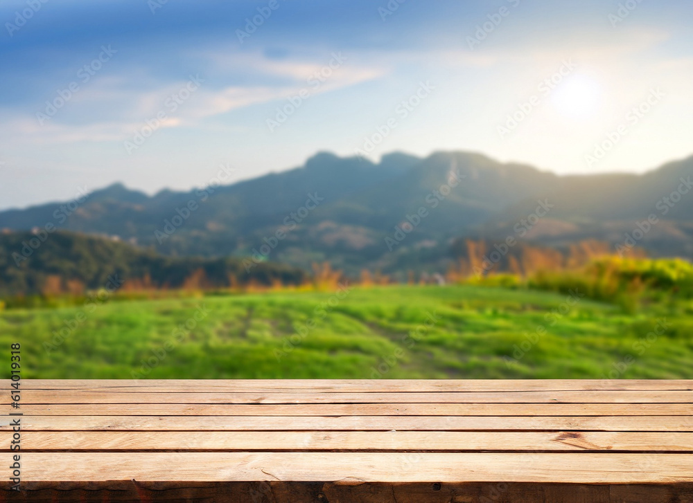 Wooden table top on blur mountain and grass field. Fresh and Relax ...