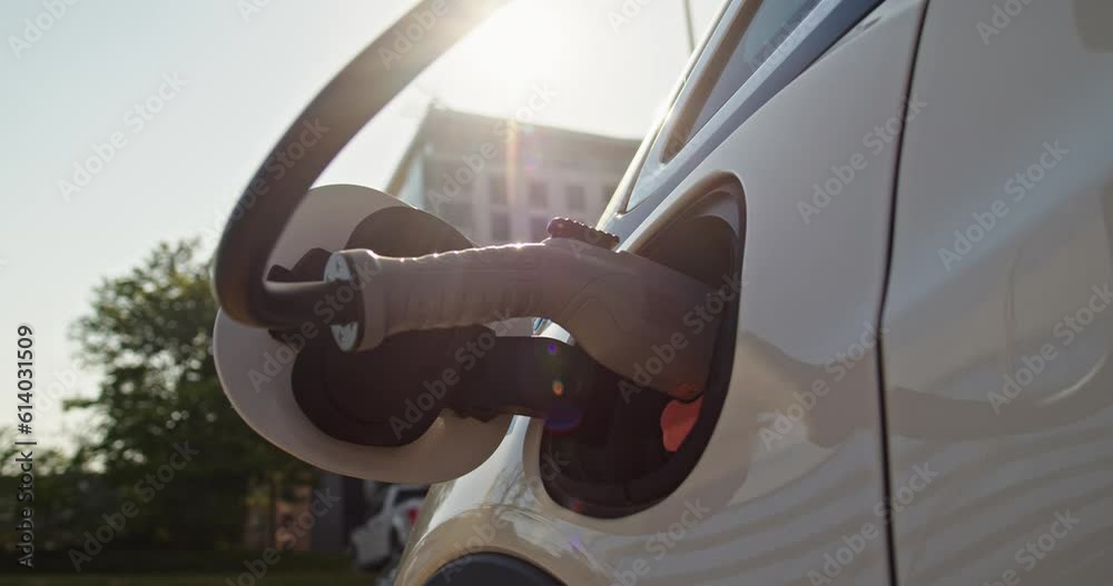 Electric Vehicle Charging Port Plugging in EV Modern Car. Electrical ...