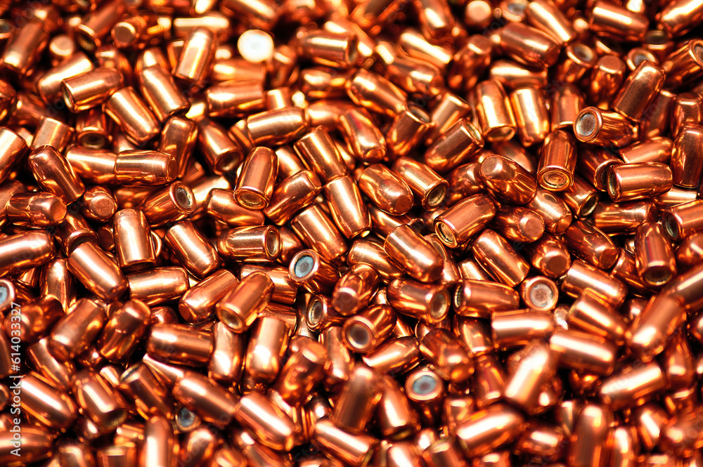 Sparkling golden bullets heap for firearms as background Stock Photo ...