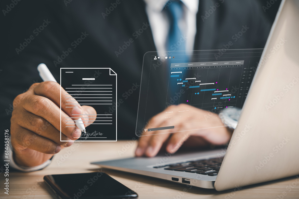 Electronic Signature Concept Businessman signs electronic documents on ...