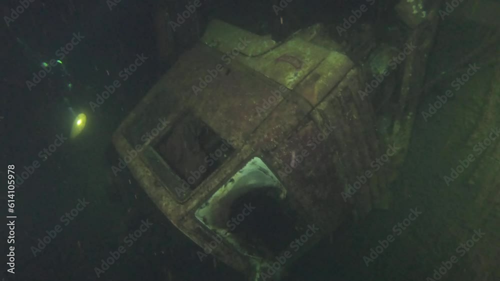 Scuba divers swims on the Shipwreck. Wreck diving. Mediterranean sea ...