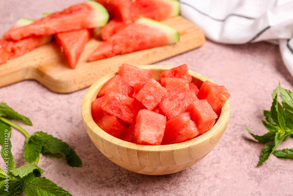 Board and bowl with pieces of fresh watermelon on pink background Stock ...