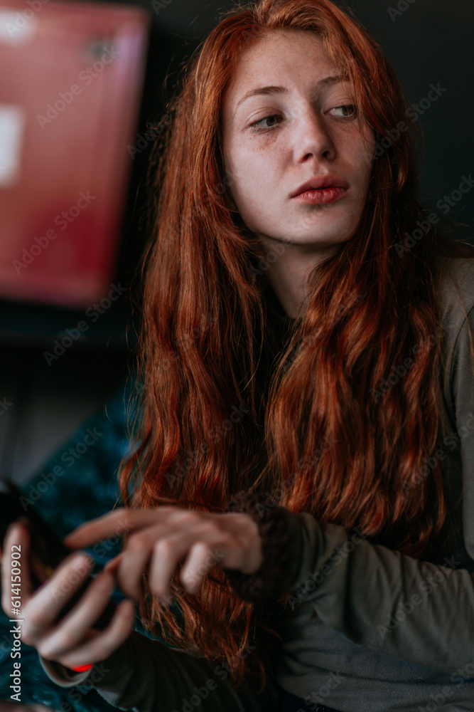 Lovely Redhead Girl Scrolling On Her Phone While Suddenly Was