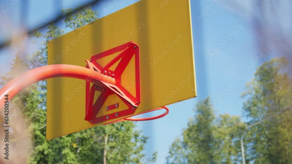 Basketball shield with rim on park sports ground view through blurry ...