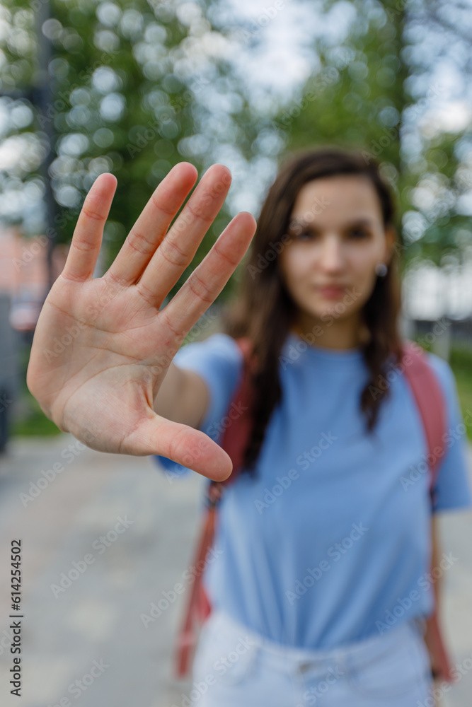 Female said stop it. Blurred portrait of young lady looking at camera ...