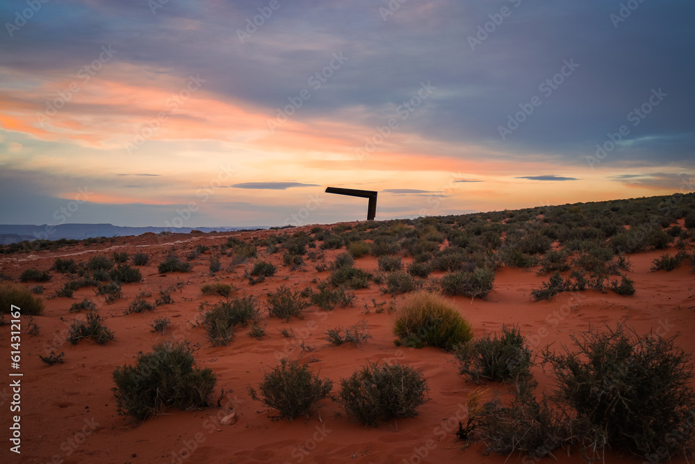A modern monolith creates a shaded viewpoint for tourists from this ...