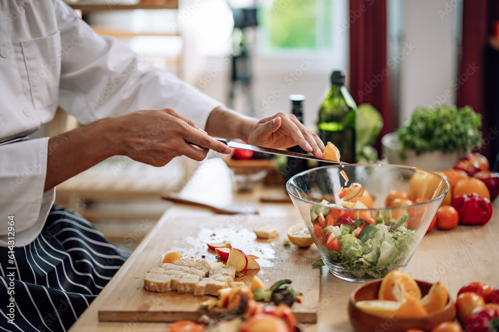 The professional master chef prepares a bowl of various types of fruit ...