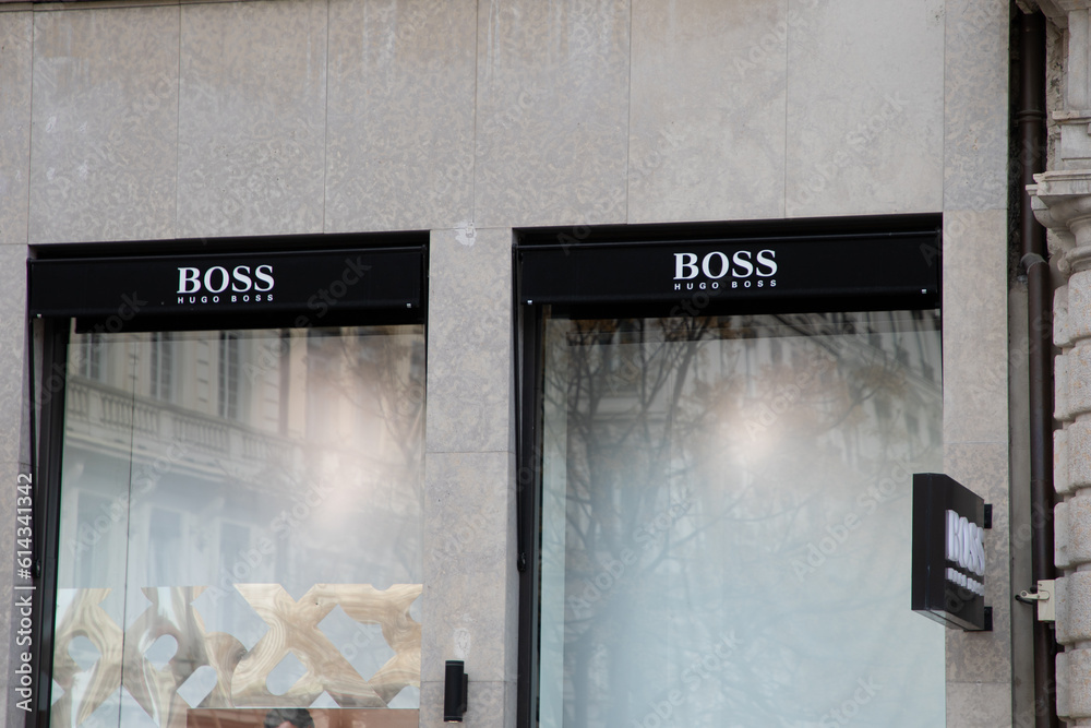 Hugo Boss store brand logo and text sign wall facade of German boutique ...