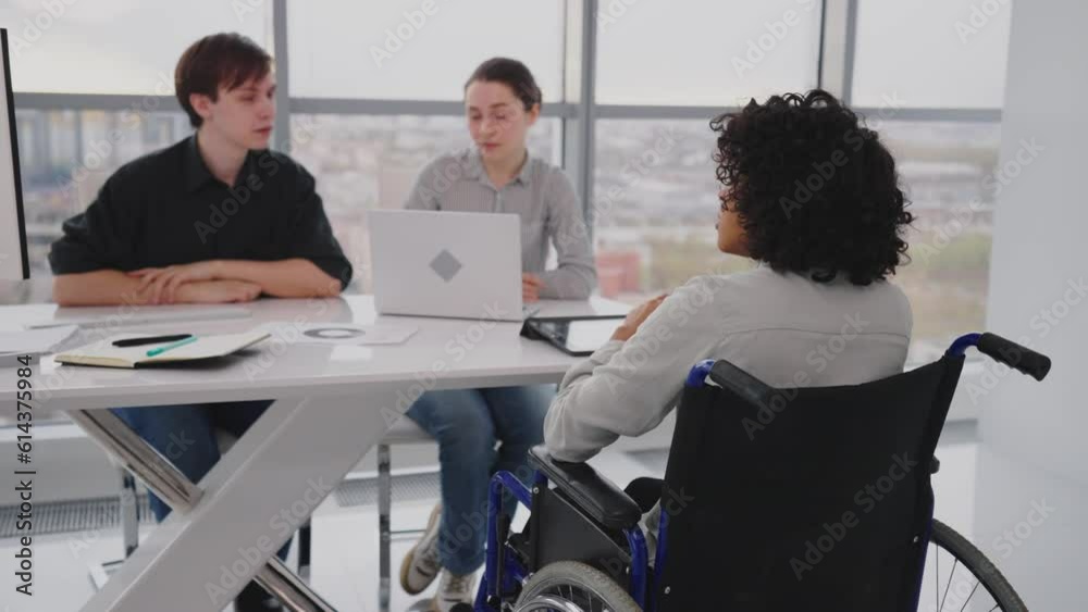 African american girl in wheelchair on job interview in modern office ...