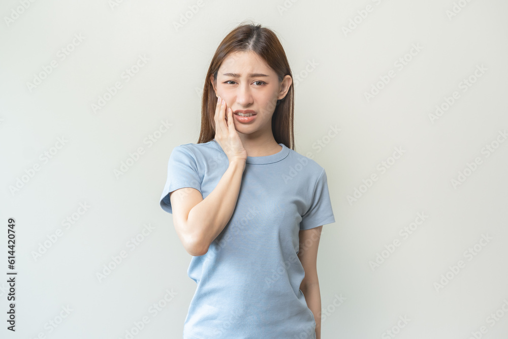 Face expression suffering from sensitive teeth and cold, asian young ...