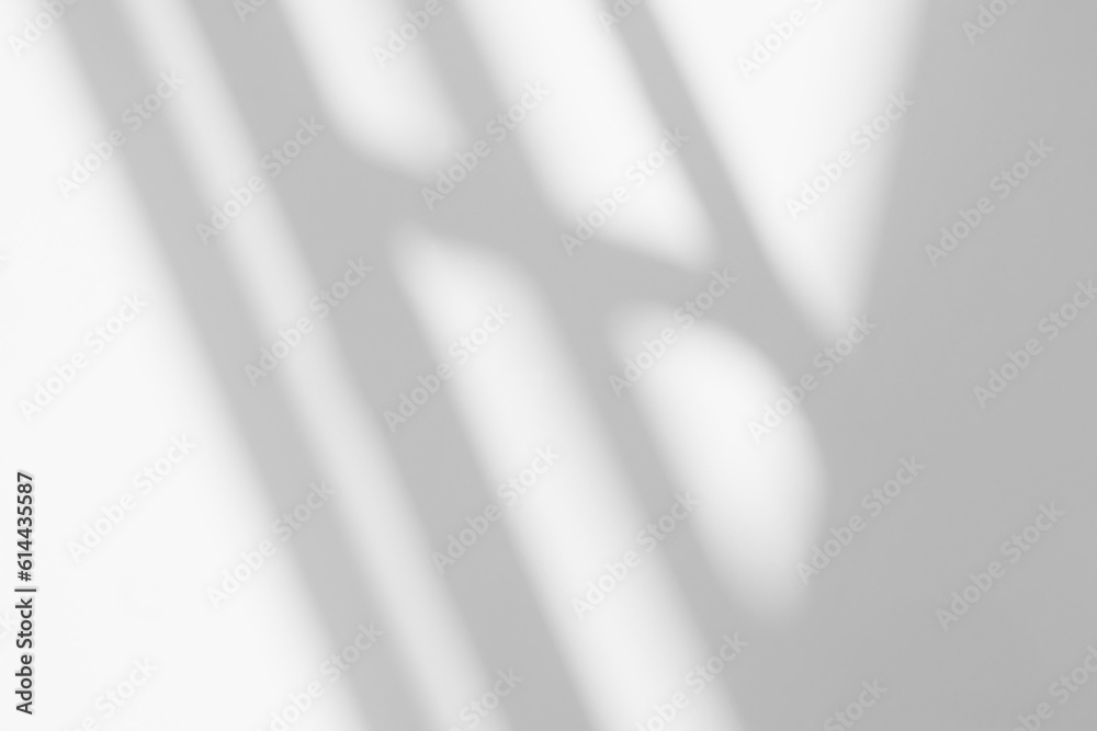 Abstract light reflection and grey shadow from window on white wall ...