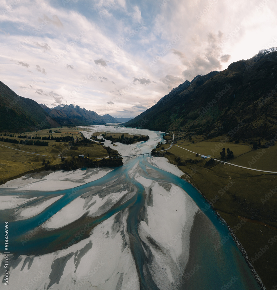 Bird's eye aerial drone view of Glenorchy-Paradise Road crossing over ...