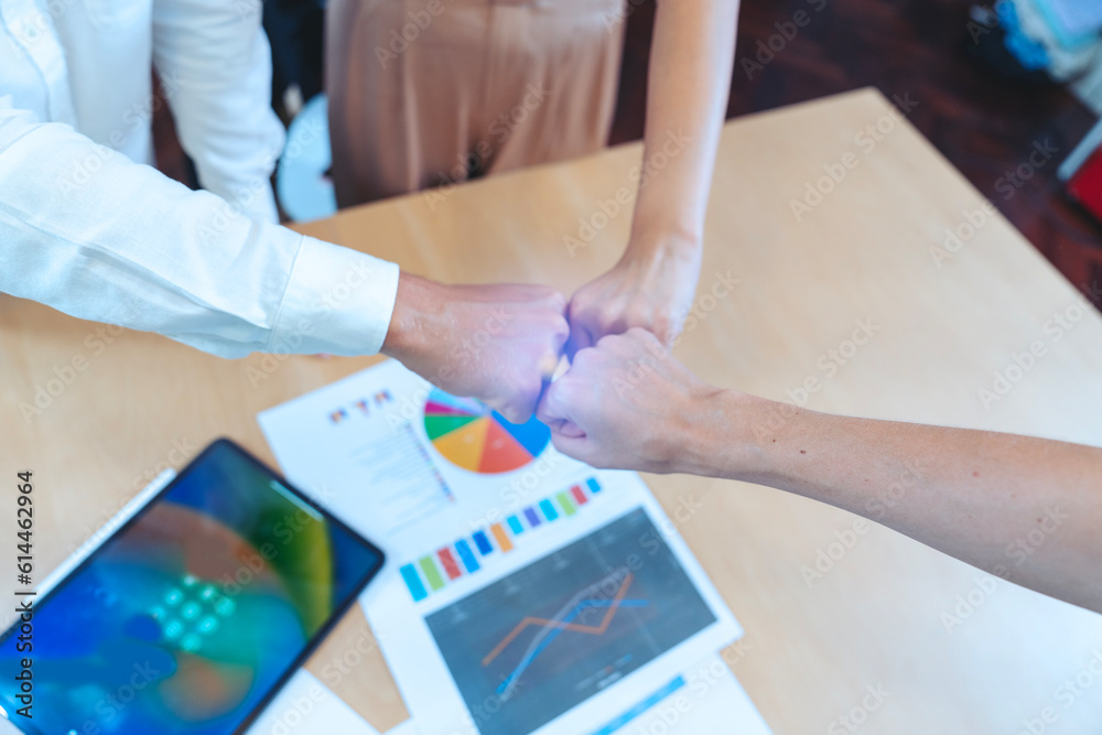 Employees work team finishes standing bumps hands collide three people ...