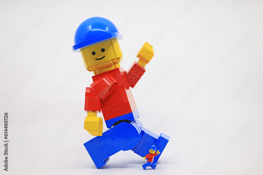 Hong Kong -June 17 2023: giant man walk with the small size man as same ...