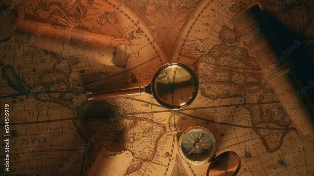 Compass and magnifier on a old vintage world map with countries and ...