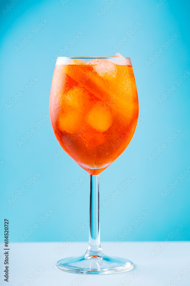 Aperol Spritz cocktail in glass on a blue background. Classic italian ...