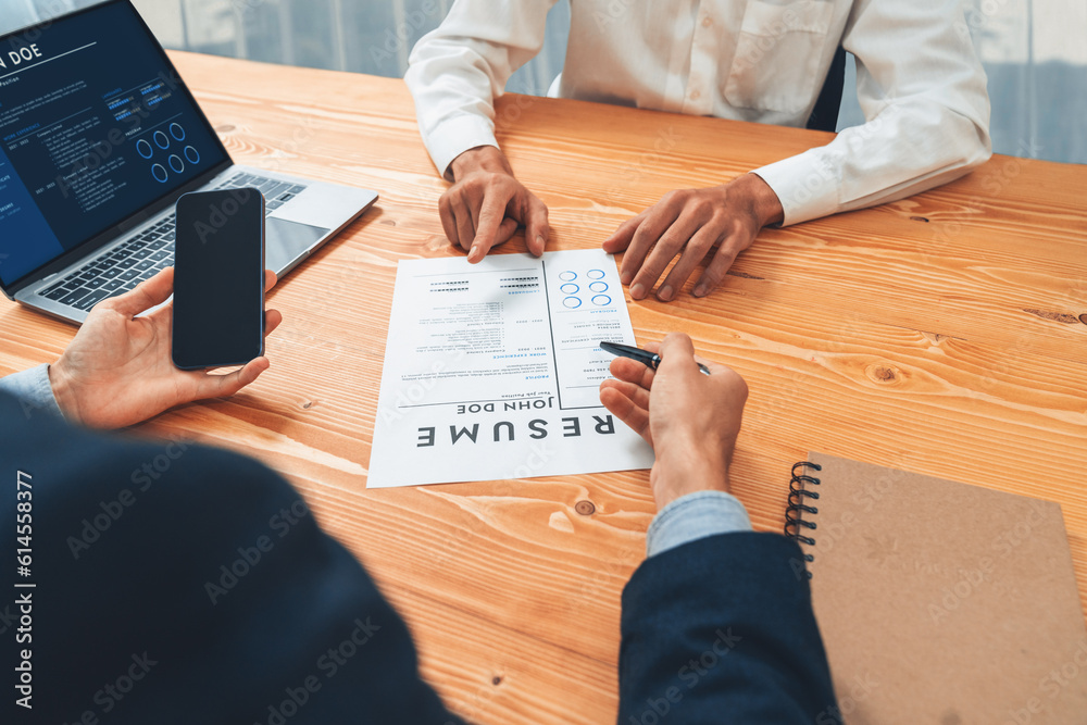 Job candidate engaging conversation with interviewer during job ...