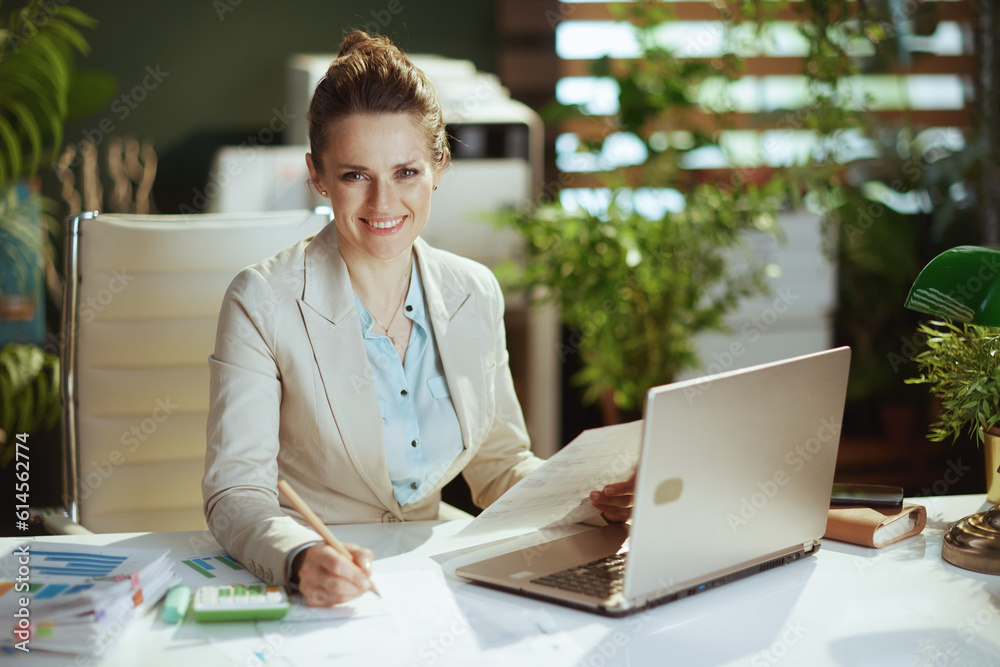 happy accountant woman in light business suit in green office Stock ...