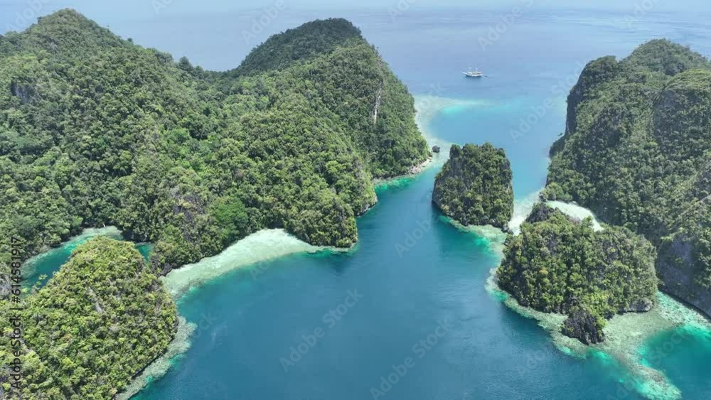 Dramatic limestone islands, eroded over millions of years, rise from ...