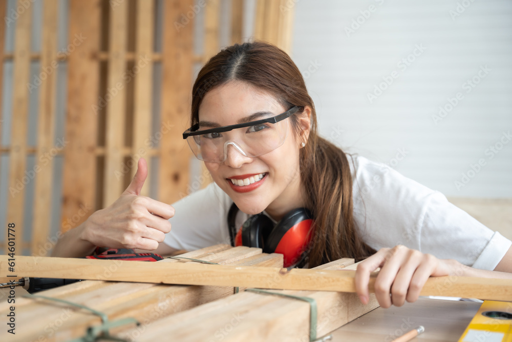 Portrait of happy asian woman thumbs up to camera with smiling. She ...