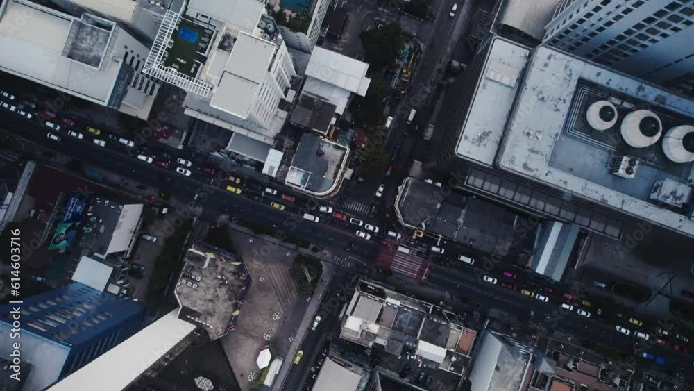 drone rotate in top down above Thailand capital Bangkok with traffic ...