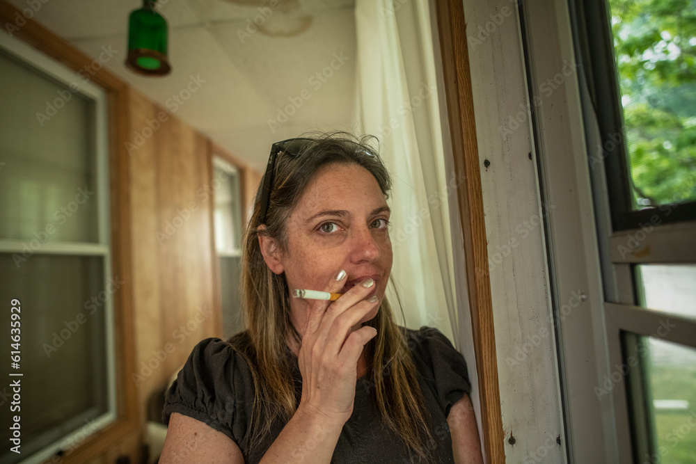 Smoking on the porch while daughter changes outfits Stock Photo | Adobe ...