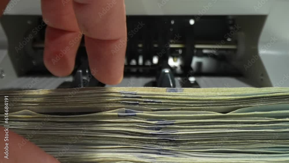 Cash money inside running banknotes counter. Banking and financial ...