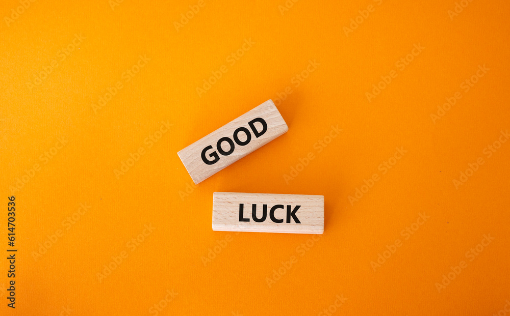 Good luck symbol. Wooden blocks with words Good luck. Beautiful orange ...