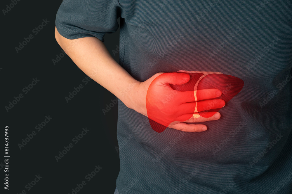 World hepatitis day concept. Male suffering from abdominal pain with ...
