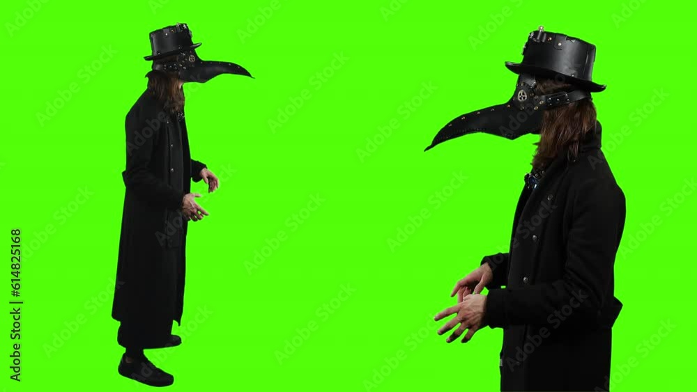 Vidéo Stock Weird Costume Man Creepy Mask Profile Shots Green Screen ...