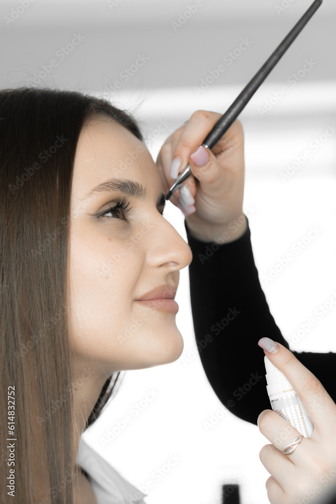 This photo shows how the eyebrow designer with care and skill creates ...