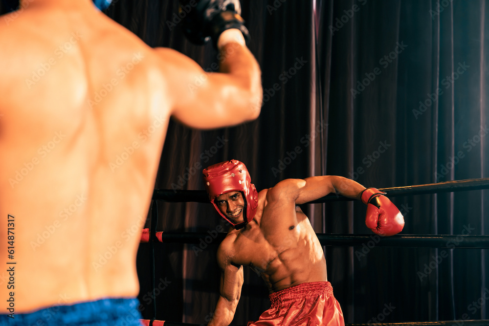 Boxer fighter with boxing helmet in fierce and intense fight while the ...