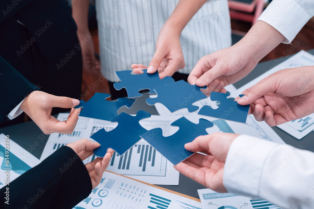 Closeup top view business team of office worker putting jigsaw puzzle ...