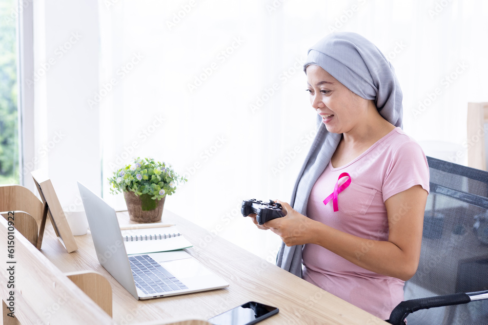 a asian women disease mammary cancer patient playing computer game on ...