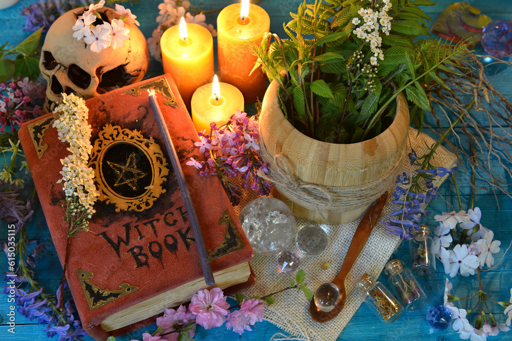 Old witch book with mortar and candles on ritualaltar table. Occult ...