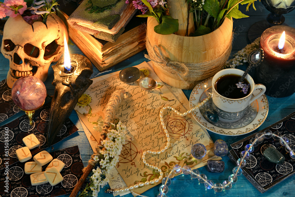 Runes, manuscript of spells and magic wand on witch ritual altar ...