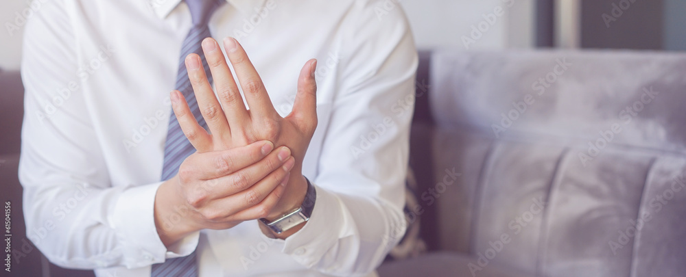 close up employee man massage on hand palm after hard working to relief ...