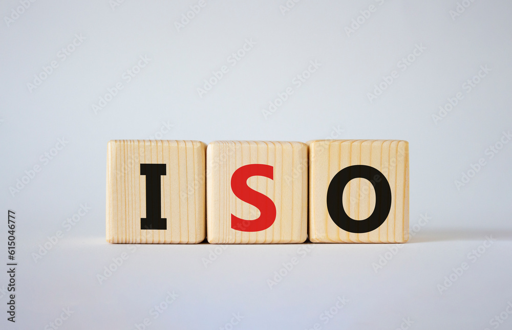 ISO standards quality control symbol. Concept word ISO on wooden cubes ...