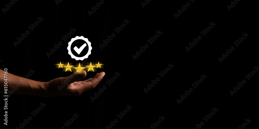 Hand shows the sign of the top service Quality, Guarantee, Standards ...