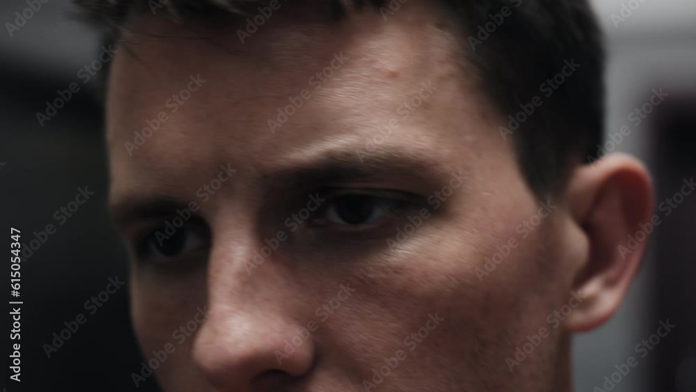 An unhappy, hopeless, angry prison inmate eyes and face walking in ...