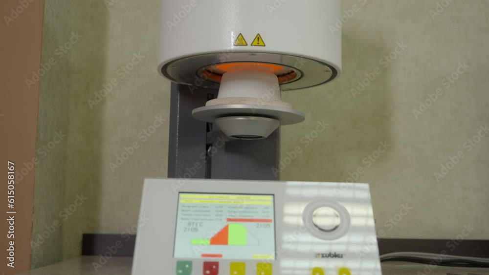 Dental press oven equipment operating at the medical laboratory ...