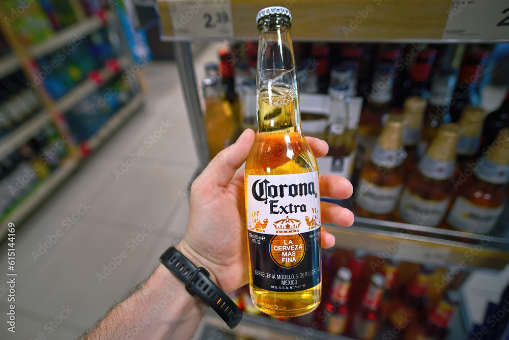 Minsk, Belarus. Jun 17, 2023. Hand holding Corona beer bottle. Corona Brewery. Man in ...