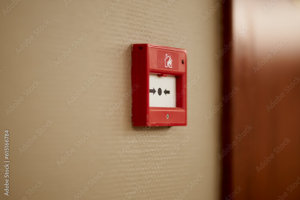 Red fire alarm button. Red fire alarm button on the wall in the room ...