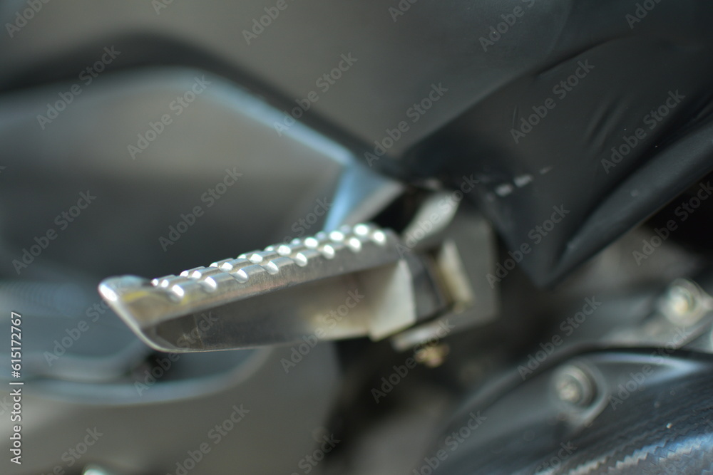 the rear footrest of a modern scooter (motor matic). The footrest ...