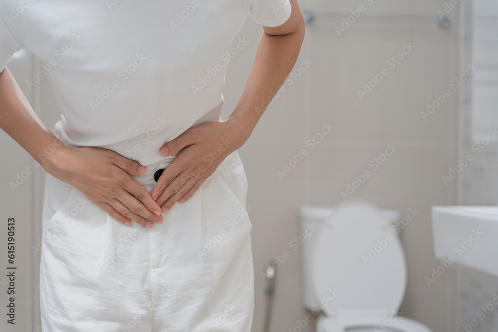 Constipation and diarrhea in bathroom. Hurt woman touch belly stomach ...