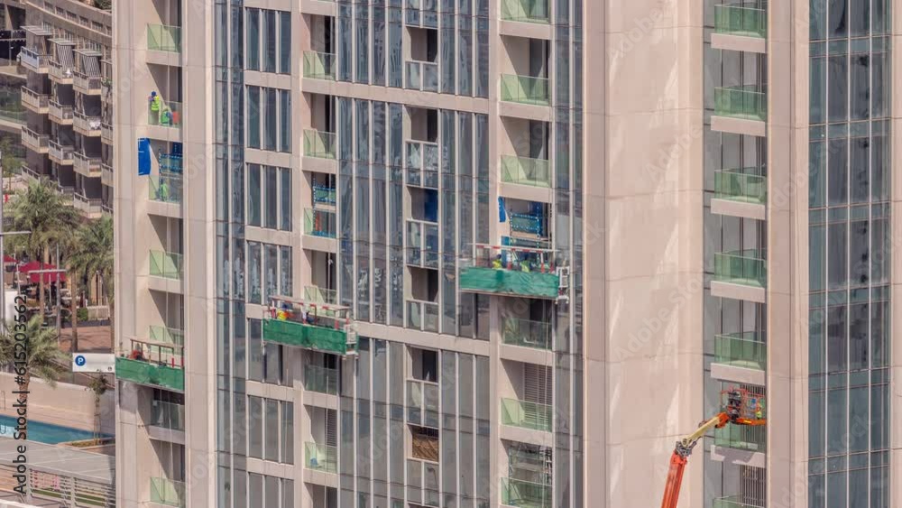 Suspended platform construction cradle hanging on building aerial ...