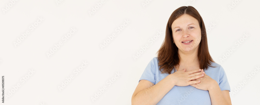 Close up of happy smiling woman say thank you, holding hands on heart ...