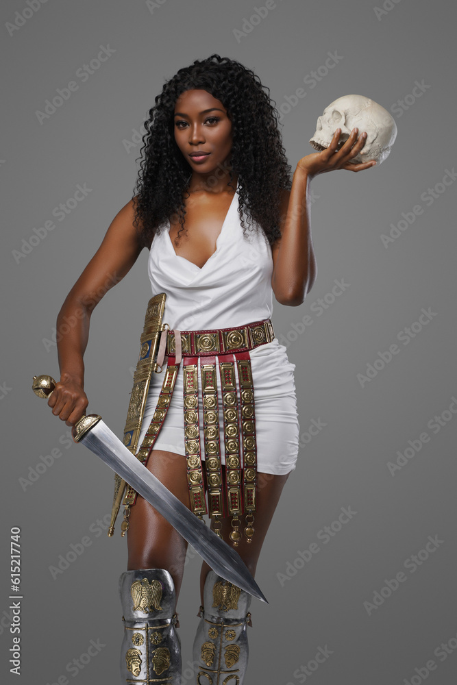 Stunning dark-skinned model dons a white Greek tunic with an ornate ...