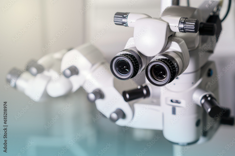 Surgical microscope in operating room with doctors. Ophthalmological ...